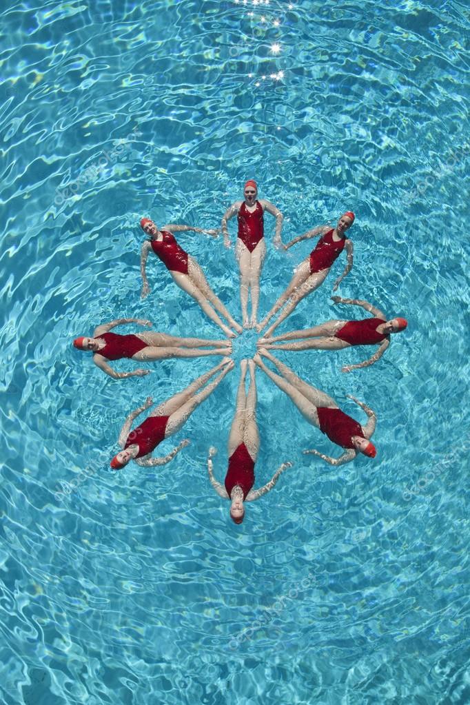 Group of synchronized swimmers — Stock Photo © londondeposit #33983115