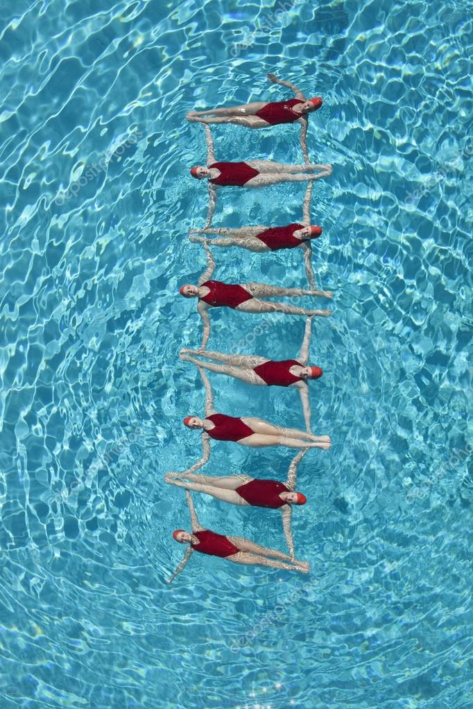 Group of synchronized swimmers — Stock Photo © londondeposit #33987959 Group of synchronized swimmers — Stock Photo © londondeposit #33987959