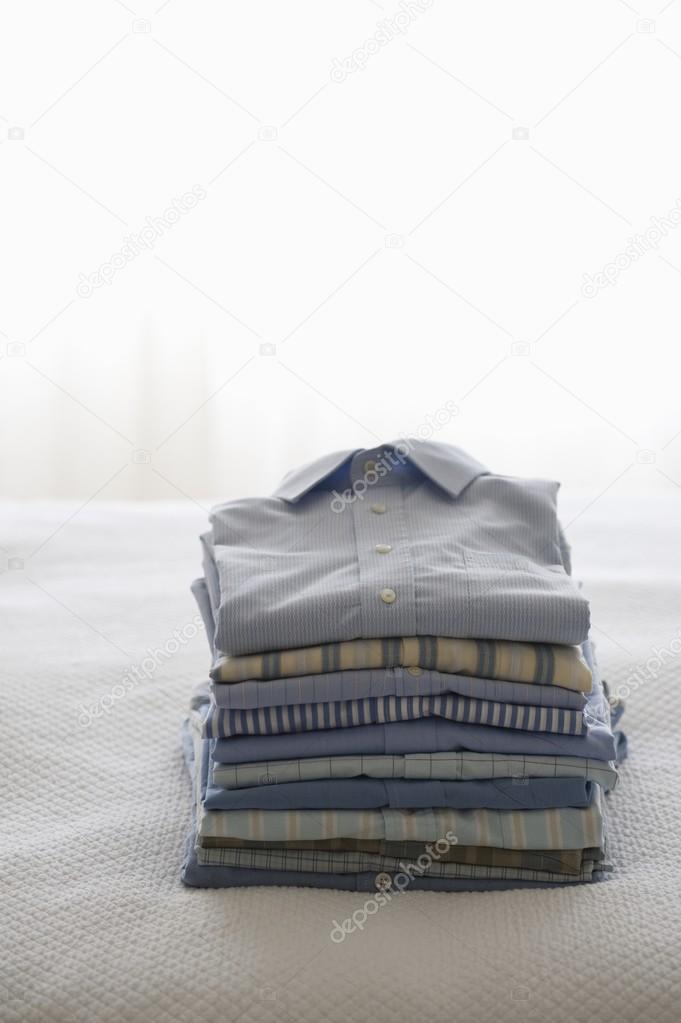 Ironed and folded shirts — Stock Photo © londondeposit #34007805
