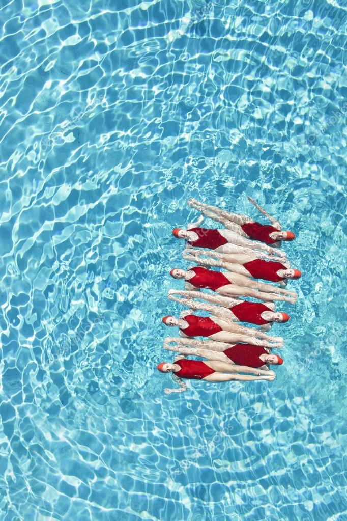 Group of synchronized swimmers — Stock Photo © londondeposit #34014459 Group of synchronized swimmers — Stock Photo © londondeposit #34014459