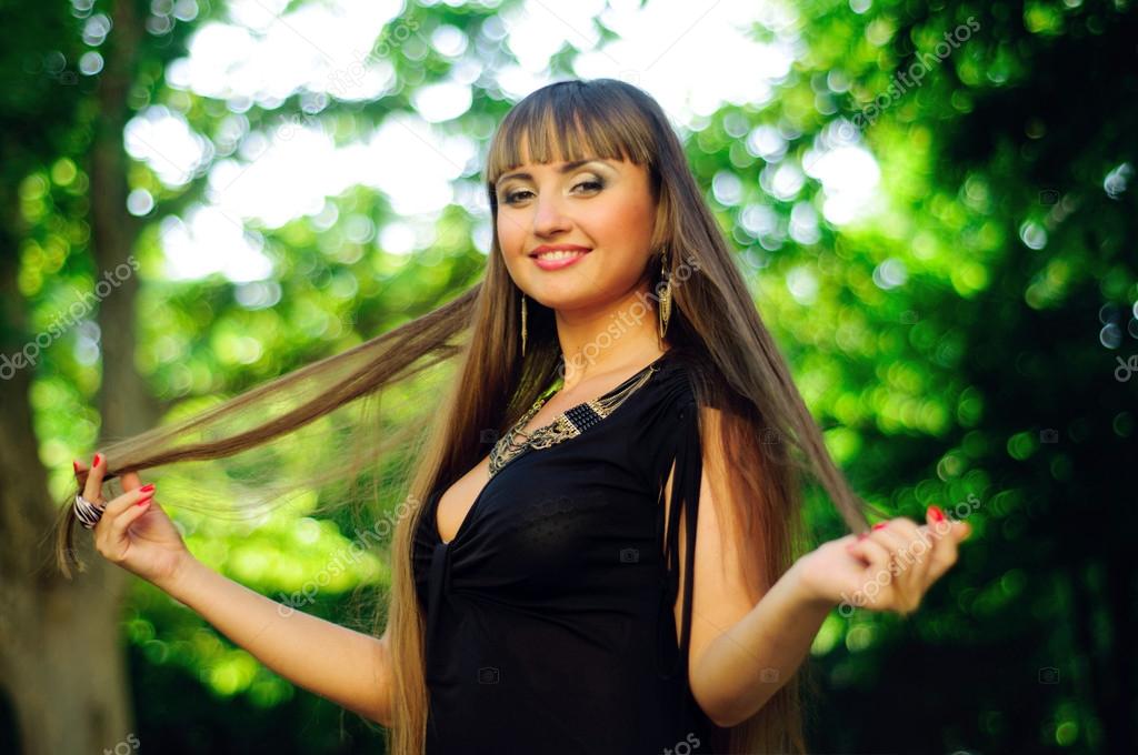 Young smiling woman with long beautiful hair — Stock Photo ...