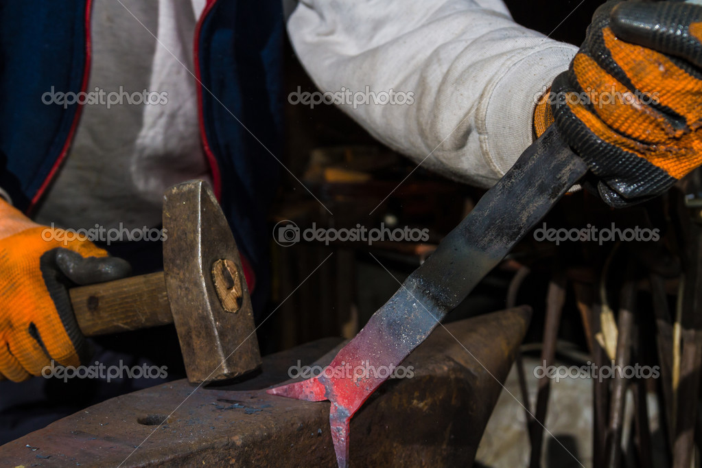 Smith forging hot iron — Stock Photo © jordan_rusev #38730563