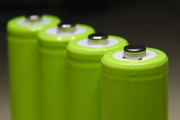 Four green batteries with blank covers Stock Photo by ©nelka7812 36745735