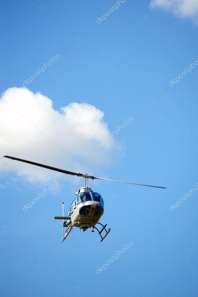 Front view of helicopter in flight. Fly over the snow mountain. Stock ...