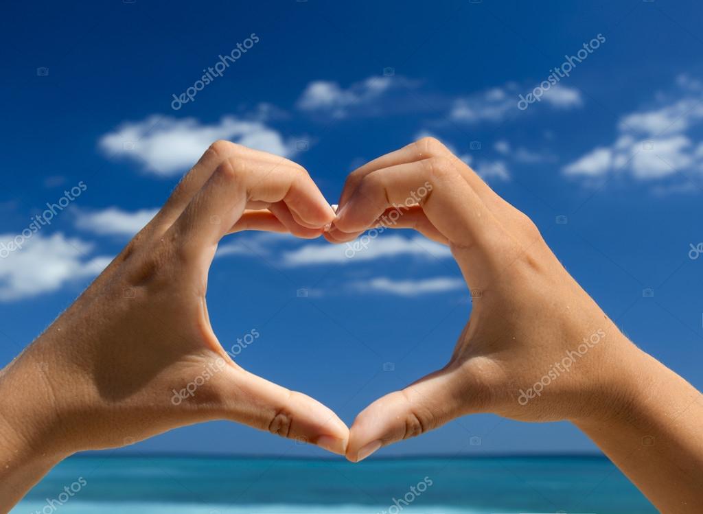 Hands making a heart shape — Stock Photo © ikostudio #18472117