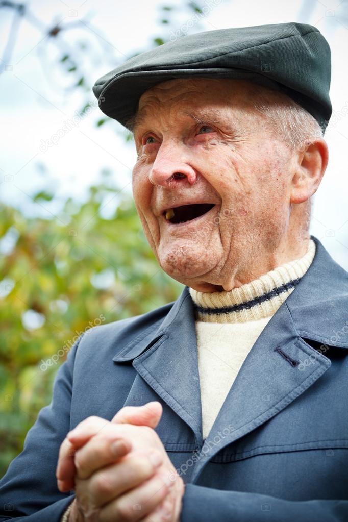 Old man smiling Stock Photo by ©grafvision 14591793