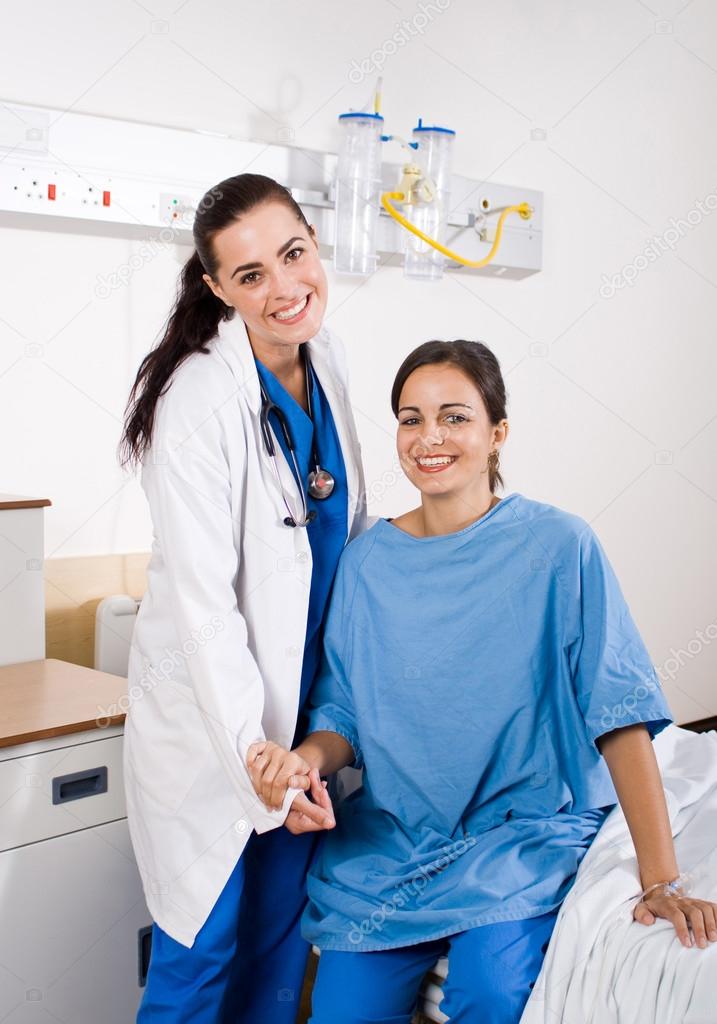 Caring nurse helping patient getting up Stock Photo by ©michaeljung ...