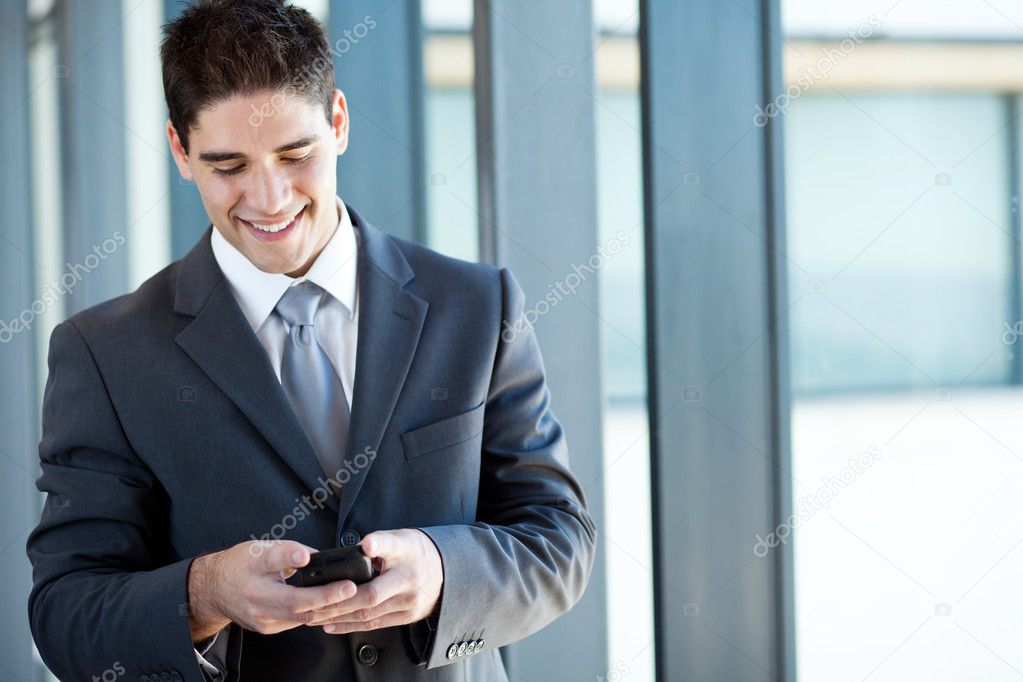 Happy businessman reading emails from a smart phone — Stock Photo ...