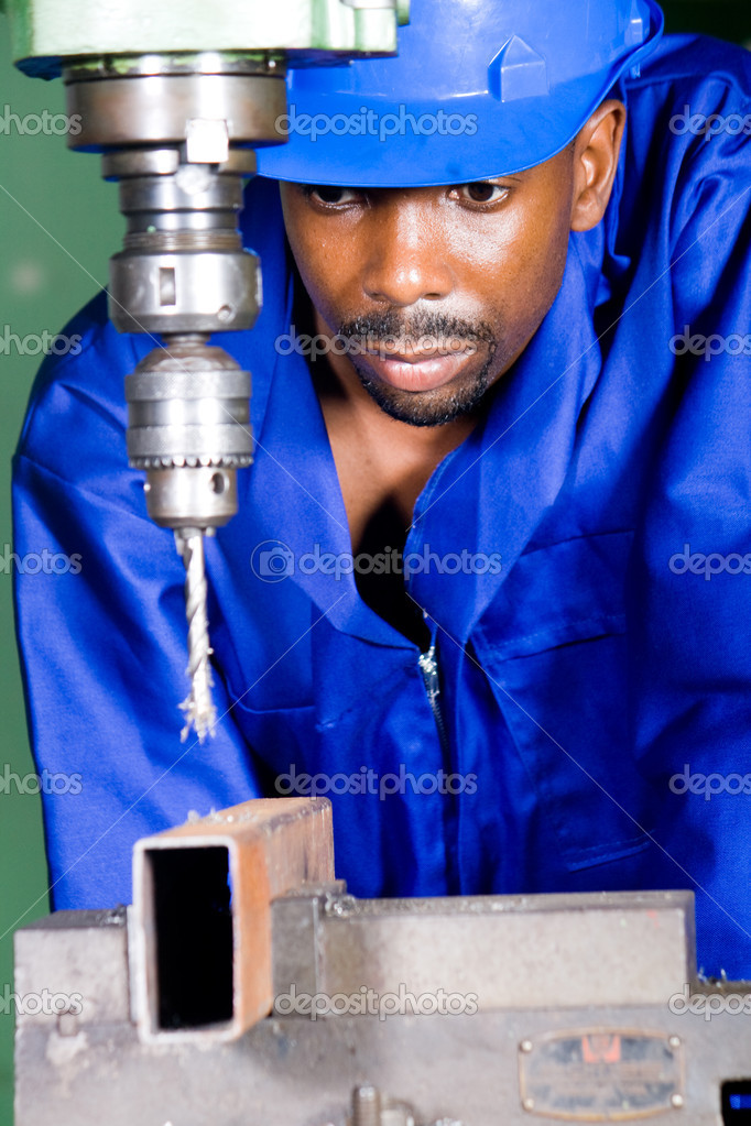 African american machinist working on tooling machine Stock Photo by ...