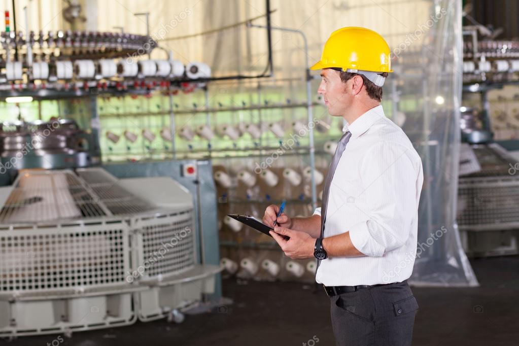 Textile prodcution manager working inside factory — Stock Photo ...