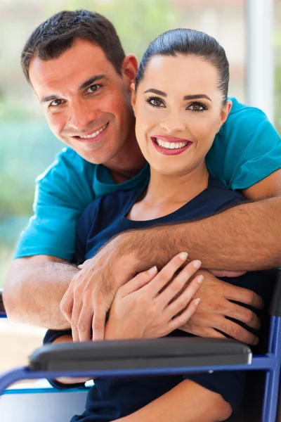 Loving husband hugging handicapped wife - Stock Image - Everypixel