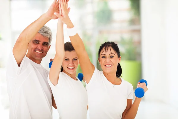 family doing high five after exercising - Stock Image - Everypixel