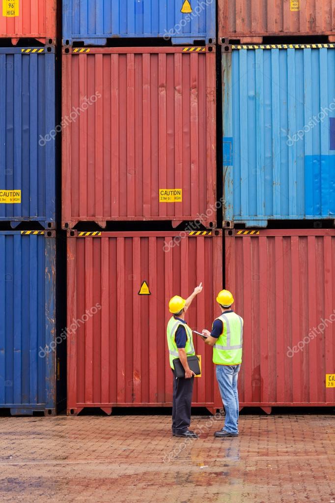 Shipping company workers counting containers Stock Photo by ...