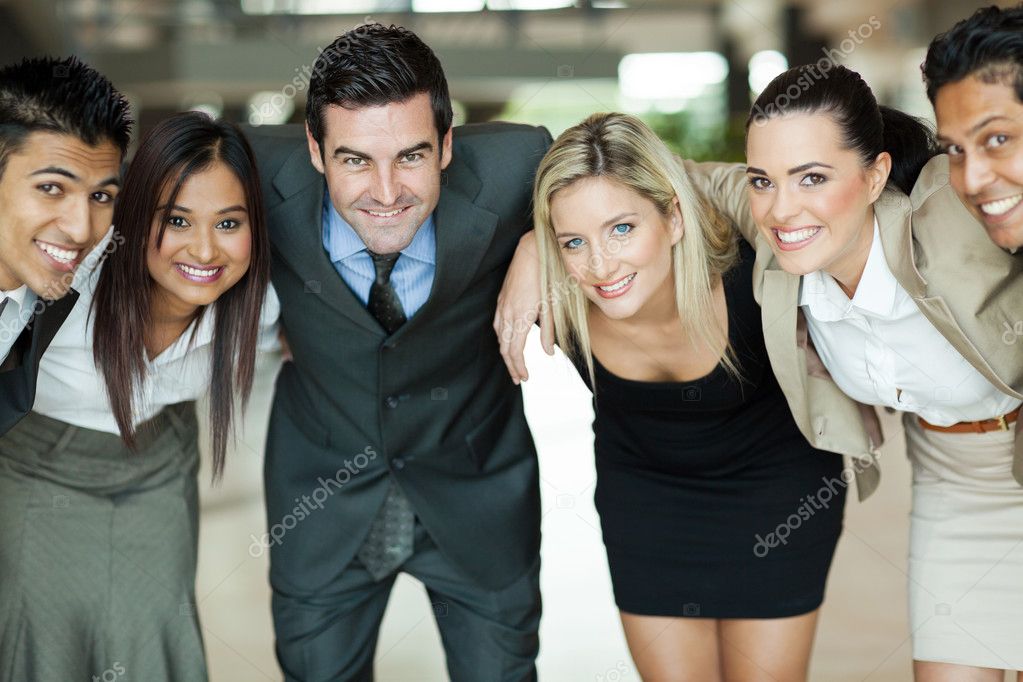 Business people huddling Stock Photo by ©michaeljung 27903555