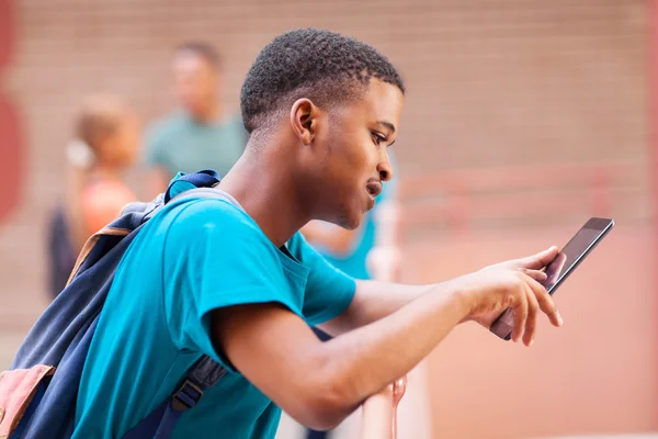 male african college student using tablet computer - Stock Image ...