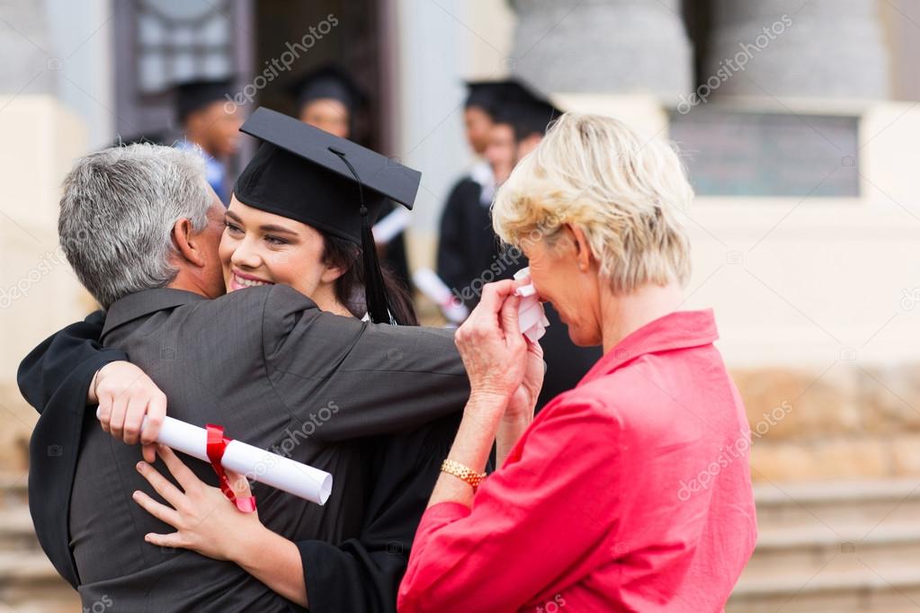 Female graduate hugging her father — Stock Photo © michaeljung #42474065