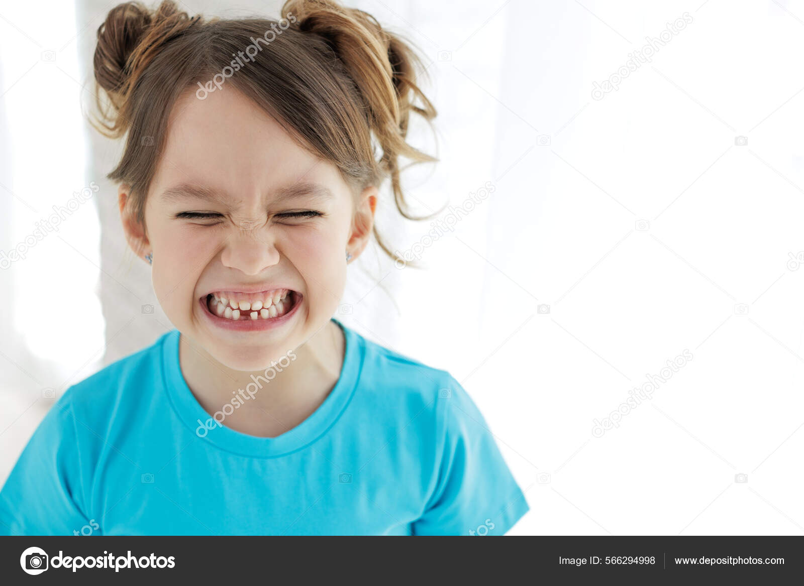 The kid lost a tooth. Baby without a tooth. Portrait of a little girl ...