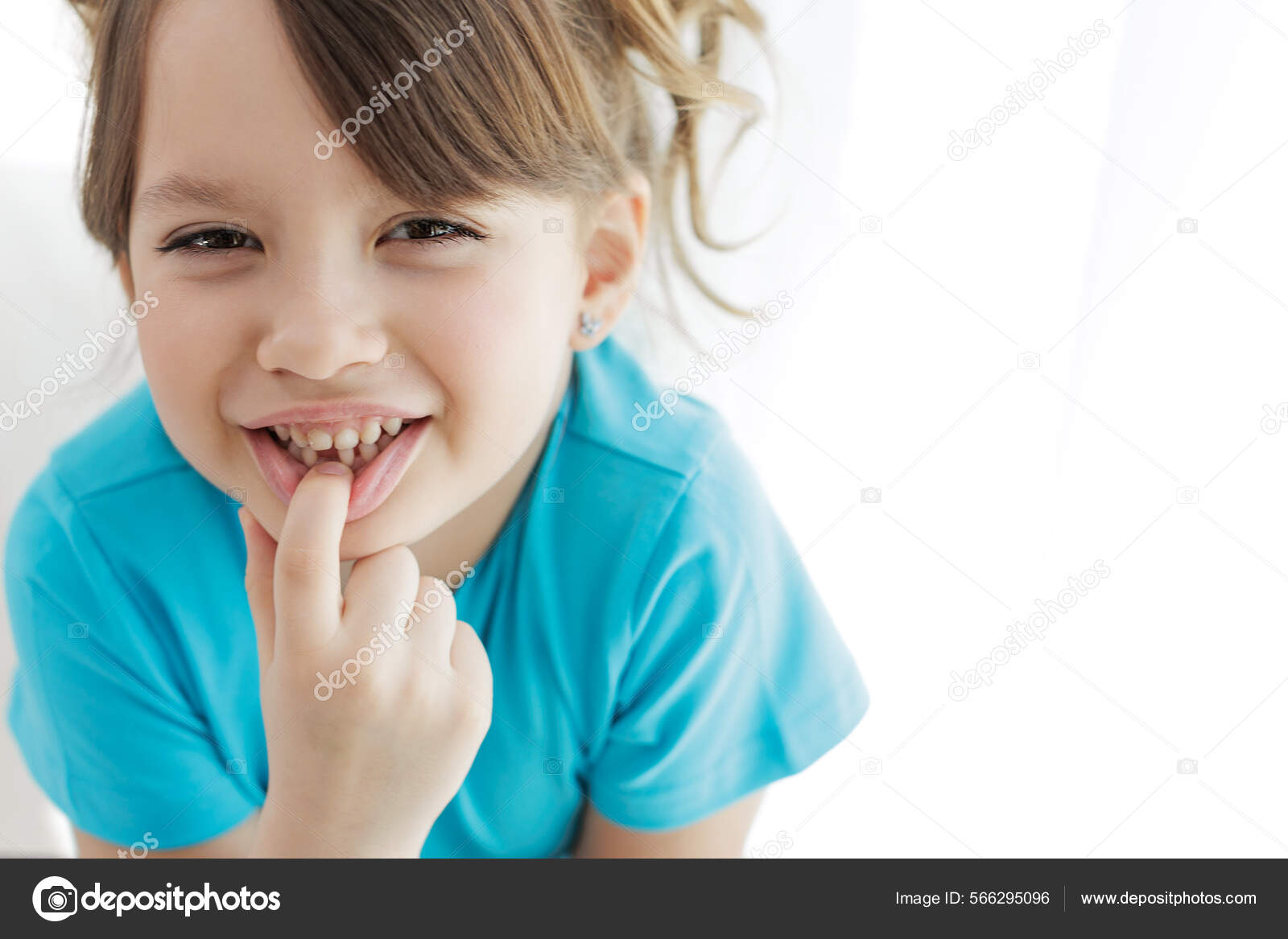 The kid lost a tooth. Baby without a tooth. Portrait of a little girl ...