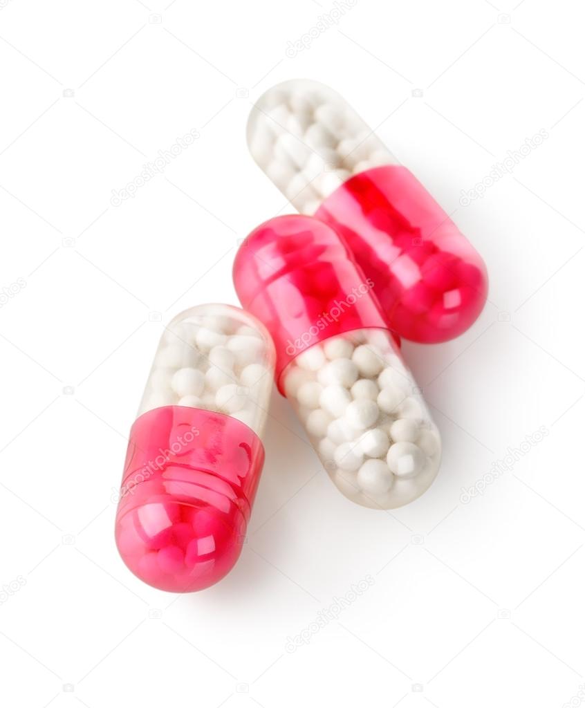 Three red capsules Stock Photo by ©Givaga 22928014