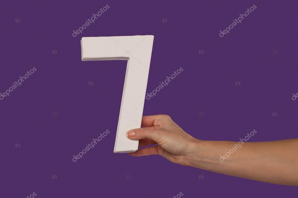 Female hand holding up the number 7 from the right — Stock Photo ...