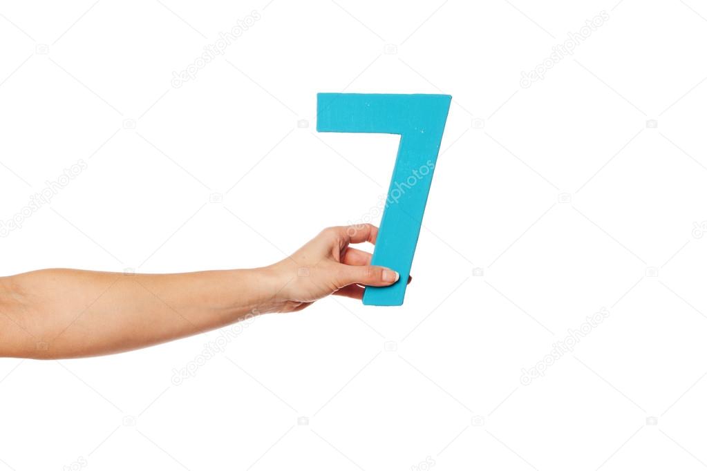 Hand holding up the number seven from the left — Stock Photo ...