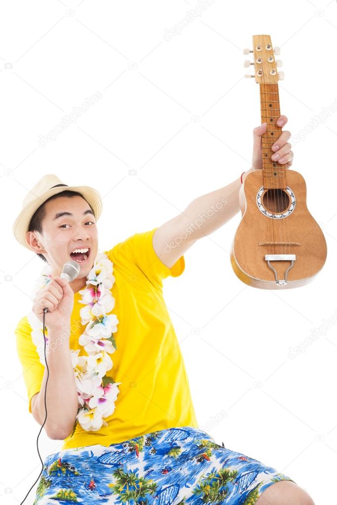 Happy man playing ukulele and singing Stock Photo by ©tomwang 26034047