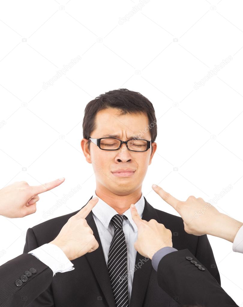 Hands pointing towards sadness businessman Stock Photo by ©tomwang 26037629