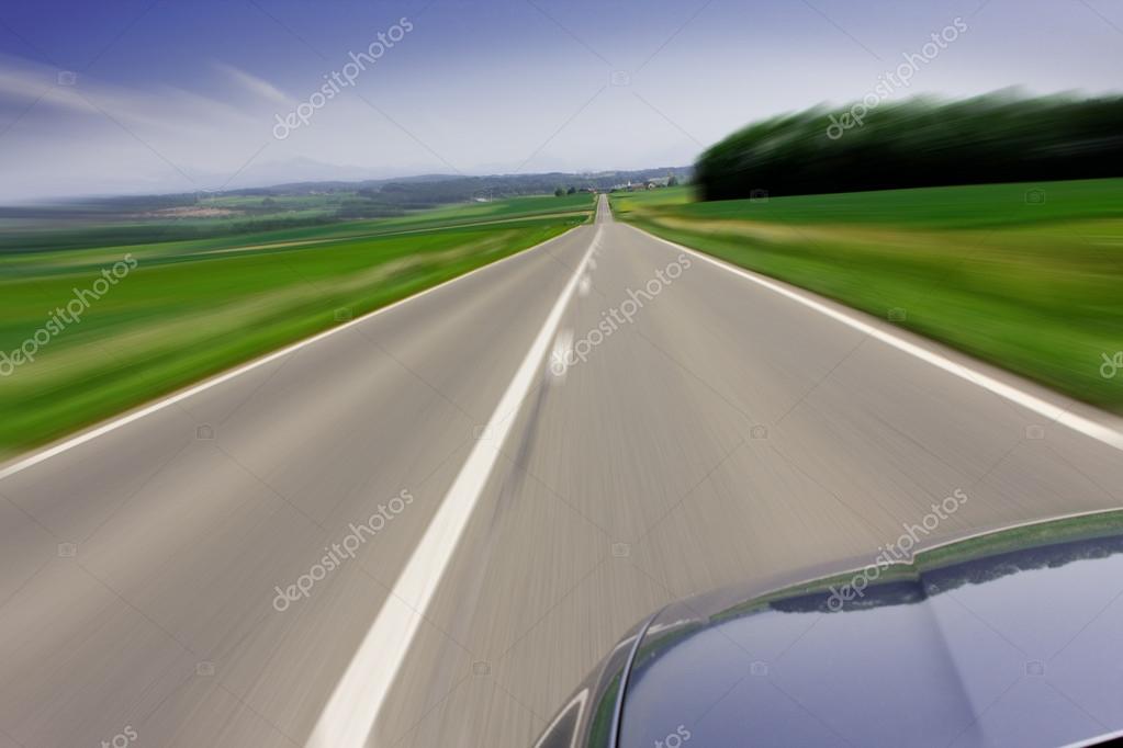 Fast moving car on road — Stock Photo © hfng08 #13580949