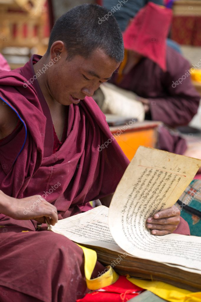 Monk reading and studying a traditional book — Stock Photo © piccaya ...