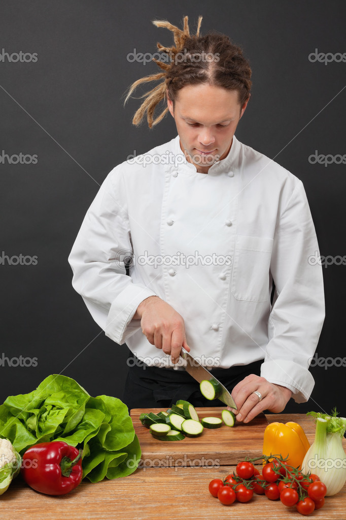Chef with dreadlocks chopping — Stock Photo © sumners #12253688