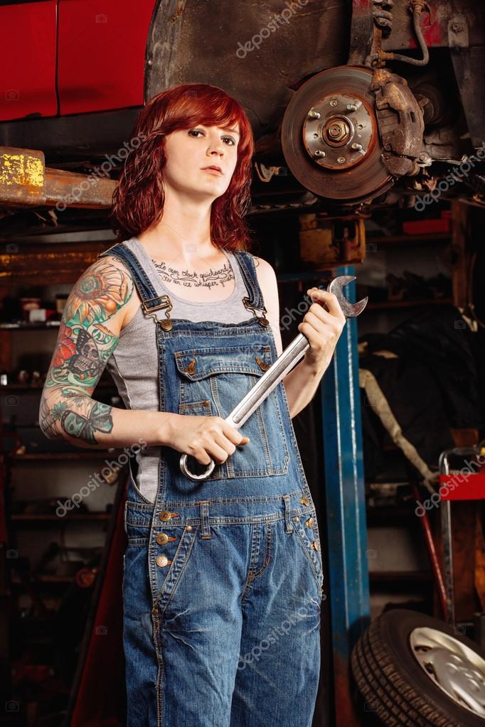 Woman fixing her car Stock Photo by ©sumners 36410079