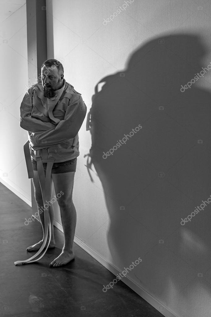 Insane man in the hallway wearing a straitjacket — Stock Photo ...