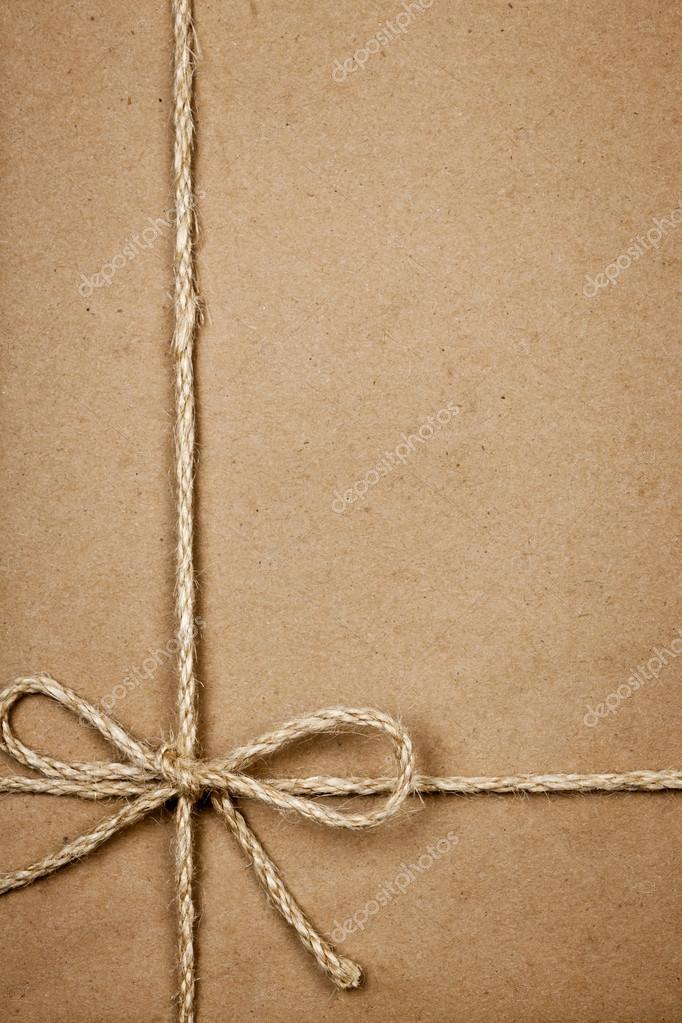 Package in brown paper tied with string Stock Photo by ©elenathewise ...