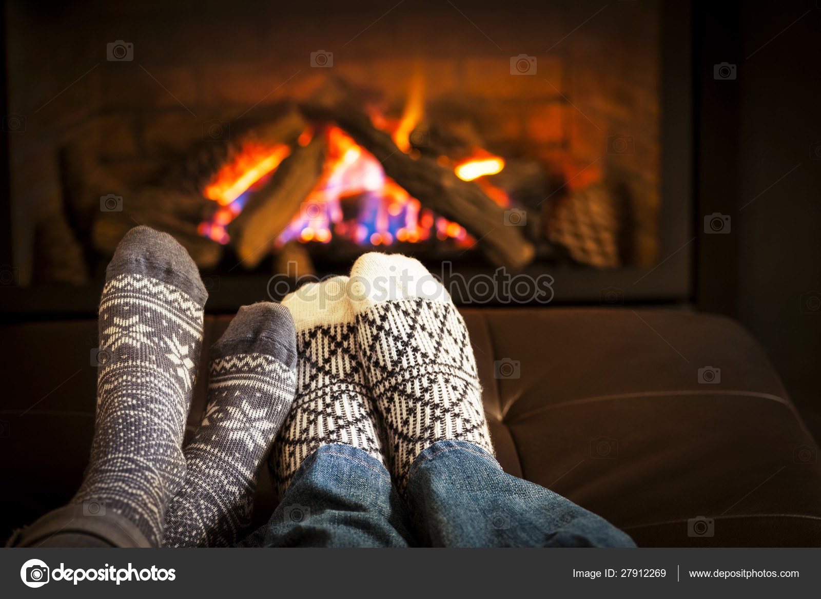 Feet warming by fireplace Stock Photo by ©elenathewise 27912269