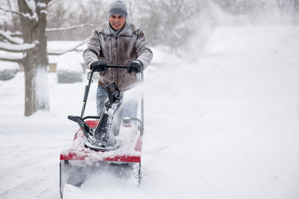 Man using snowblower — Stock Photo © elenathewise #43173541