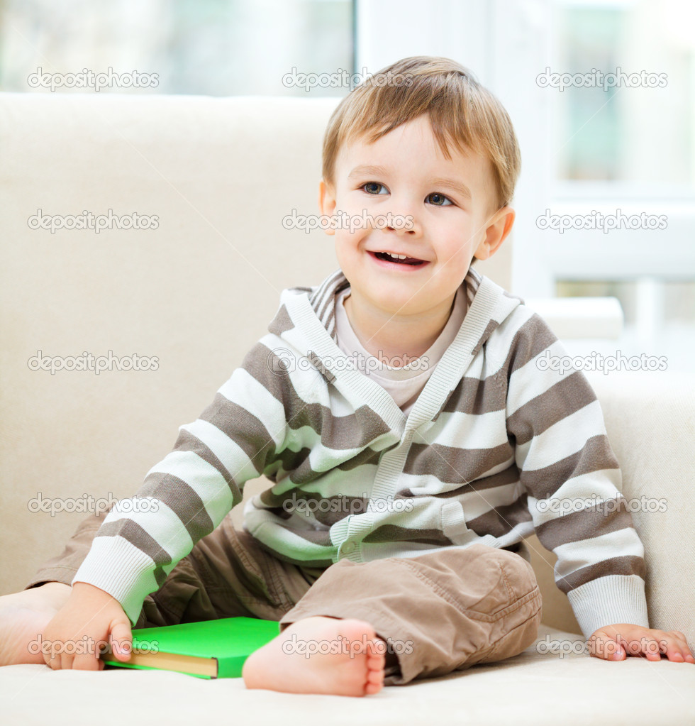 Little boy is reading book Stock Photo by ©Kobyakov 21741539
