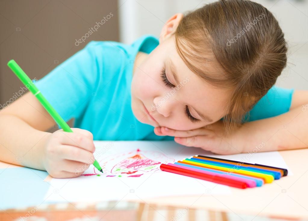 Cute cheerful child drawing using felt-tip pen Stock Photo by ©Kobyakov ...