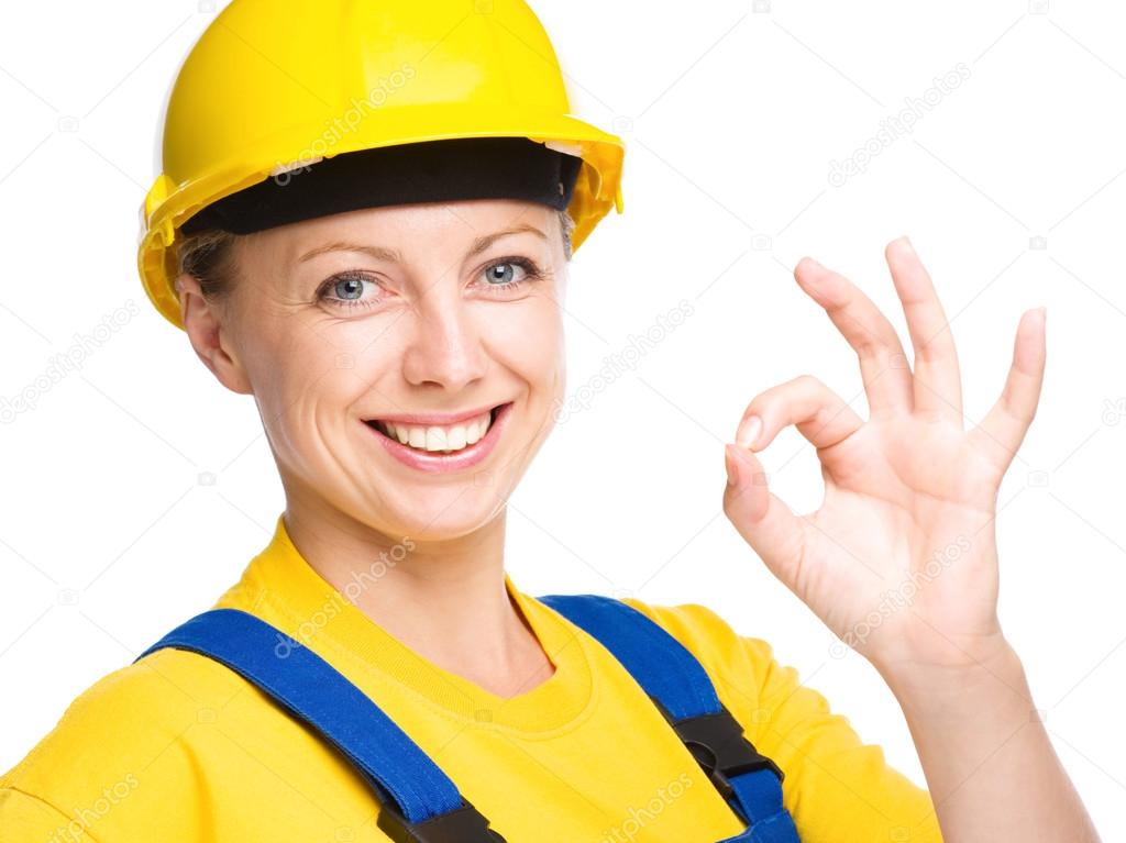 Young construction worker is showing OK sign — Stock Photo © Kobyakov ...