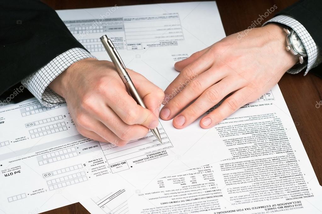 Business men filling out some documents on a desk. — Stock Photo ...