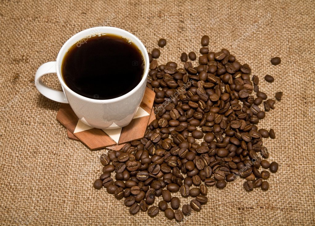 Grains and cup of coffee Stock Photo by ©valzan 40672805