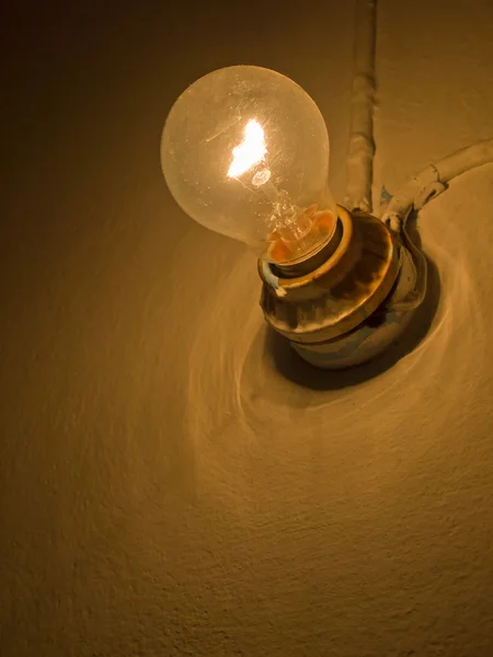 Old Light bulb on wall — Stock Photo © nuttakit #5890972