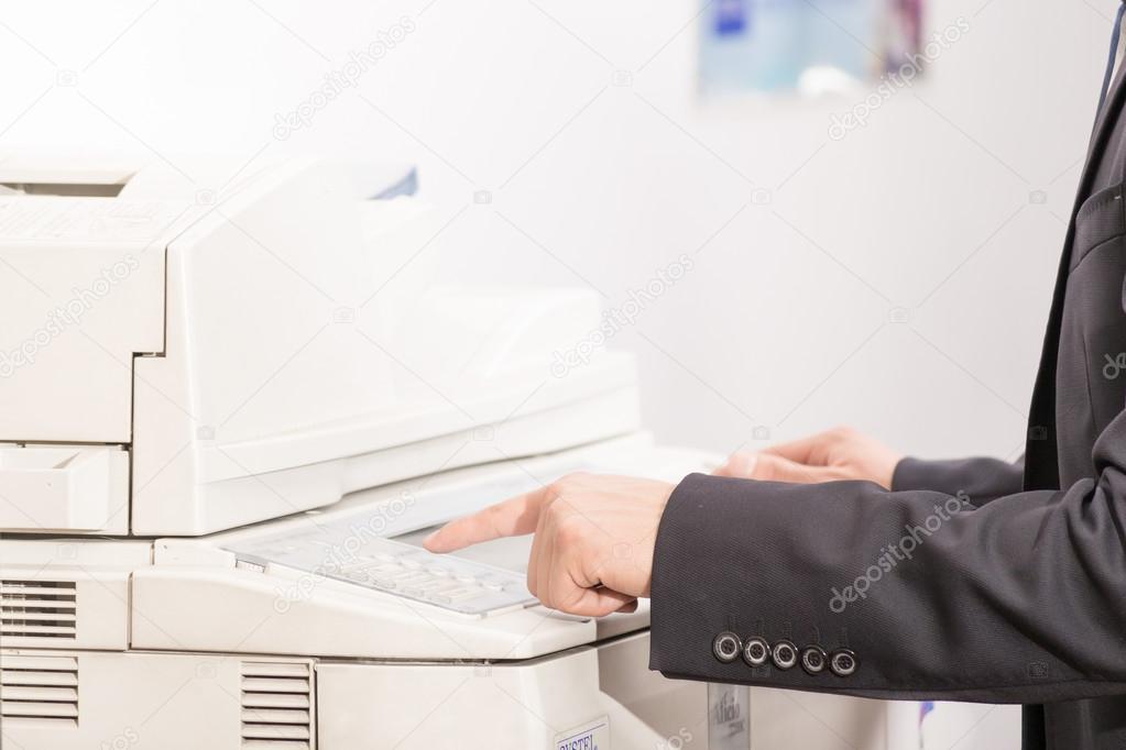 Man using a copy machine (shallow DOF) — Stock Photo © pxhidalgo #39133525