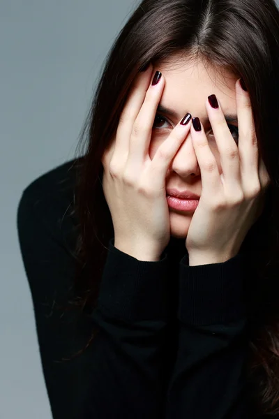 Woman with hands over her head — Stock Photo © Vadymvdrobot #38412789