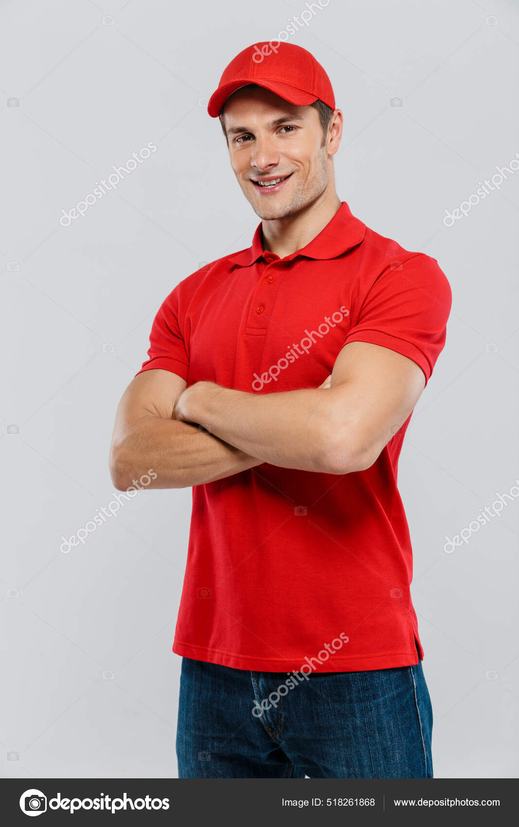 Young Delivery Man Wearing Uniform Smiling While Posing Arms Crossed