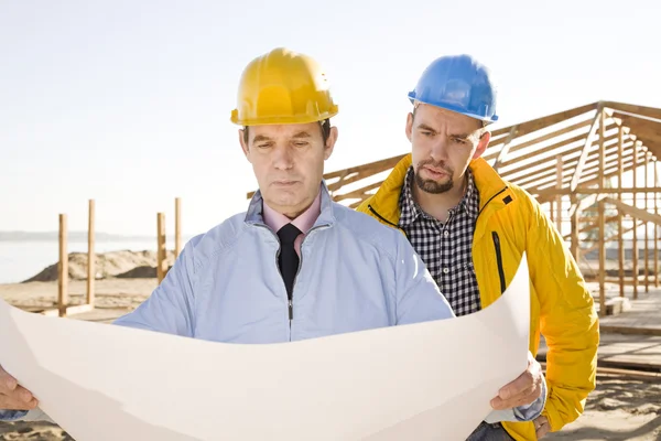 Engineers builders at construction site Stock Photo by ©kalinovsky 3247758