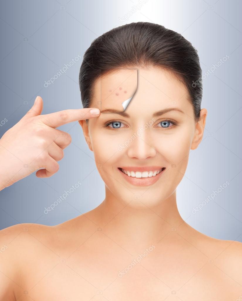 Beautiful woman pointing to forehead — Stock Photo © Syda_Productions ...