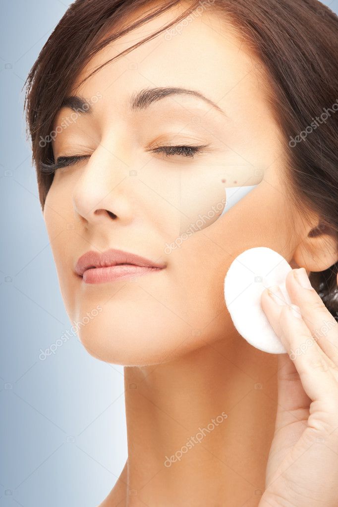 Beautiful woman with cotton pad — Stock Photo © Syda_Productions #17136813