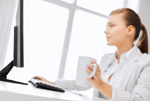 Businesswoman with computer in office - Stock Image - Everypixel