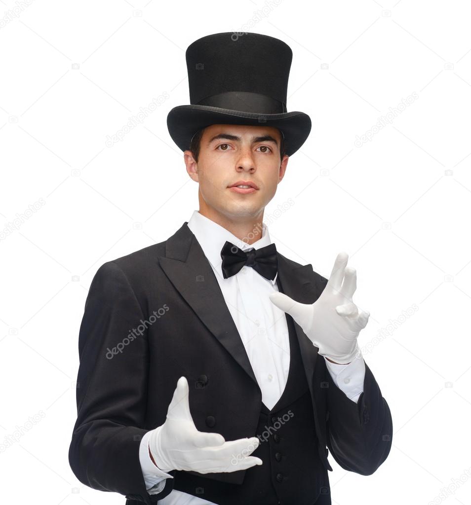 Magician in top hat showing trick Stock Photo by ©Syda_Productions 33610519