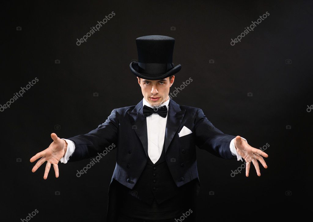 Magician in top hat showing trick Stock Photo by ©Syda_Productions 34574013